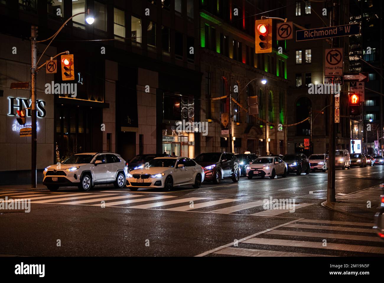 many cars waiting in traffic light for green signal to go Stock Photo ...