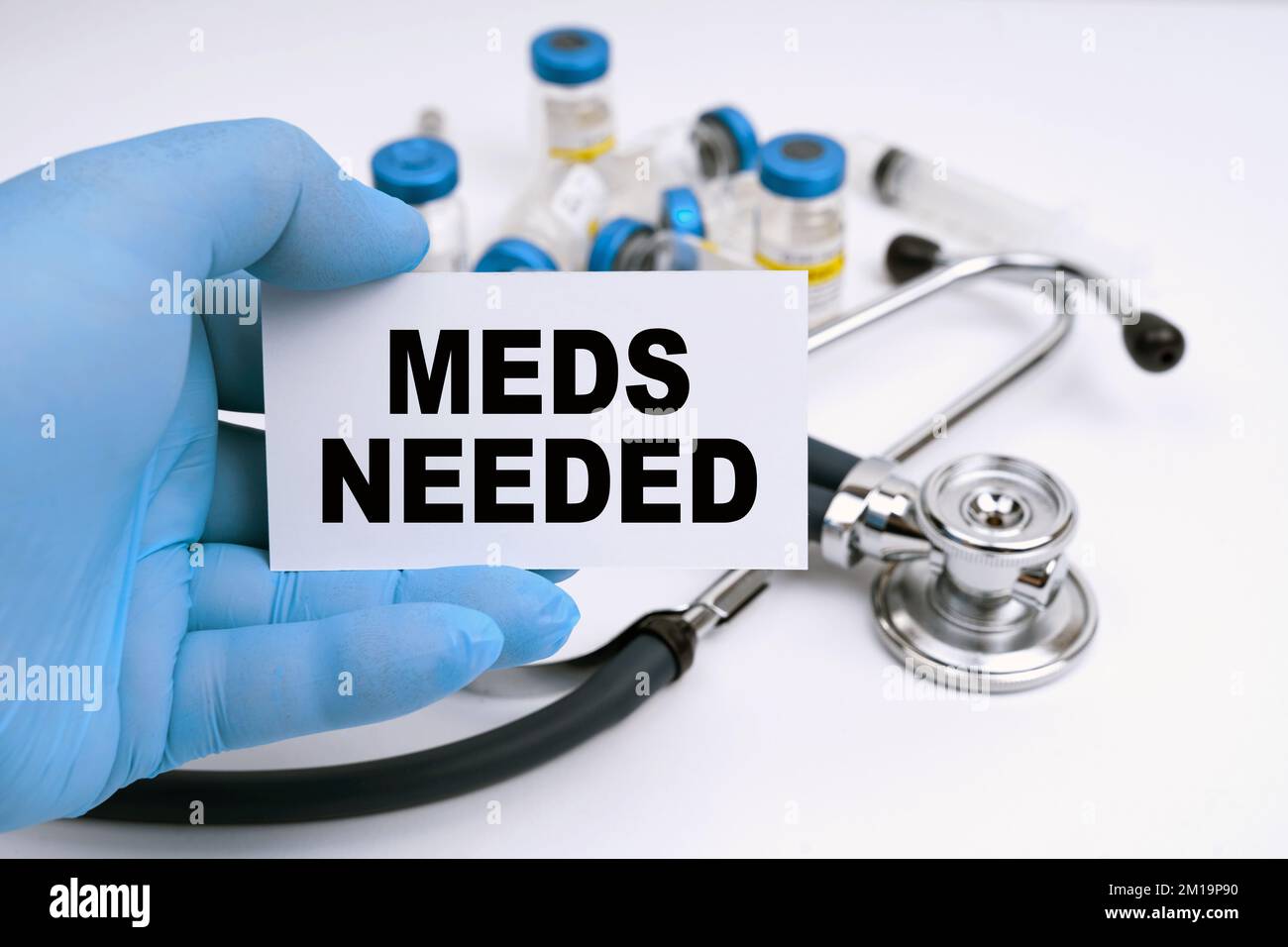Medicine and health concept. A stethoscope and ampoules lie on a white ...
