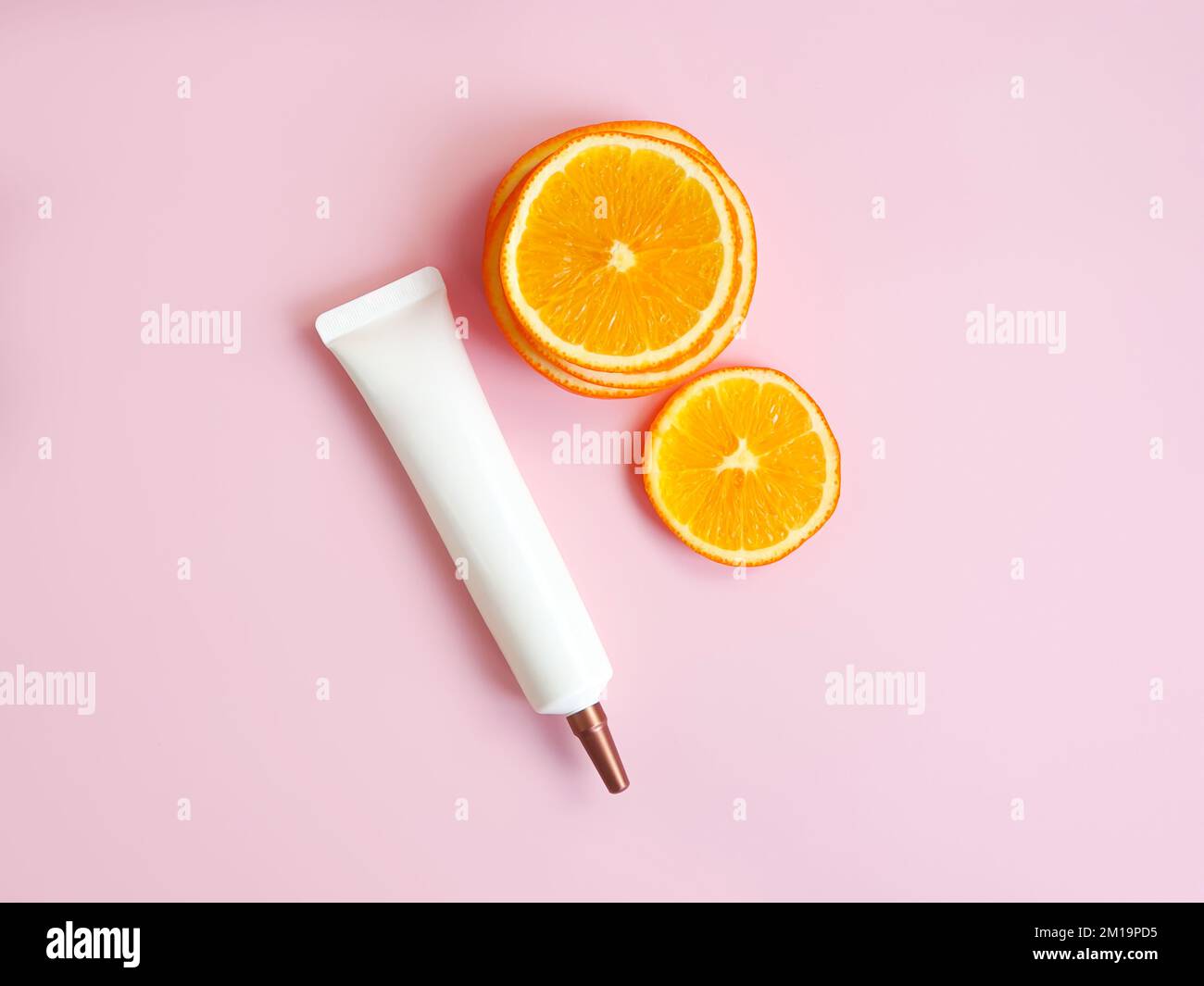 Top view of face and eye cream squeeze cosmetic tube with long nozzle ...