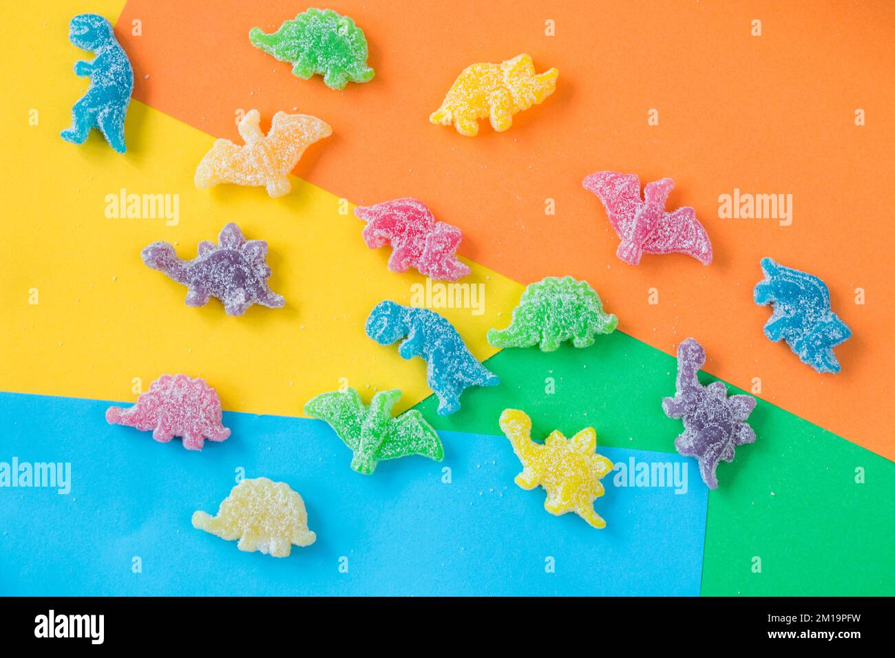 Dinosaurs colorful jelly bonn, candies on the color background Stock ...