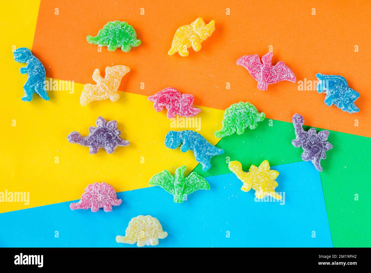 Dinosaurs colorful jelly bonn, candies on the color background Stock ...