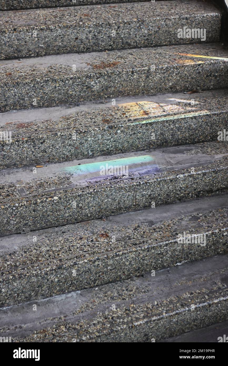 Old worn and weathered industrial stairs at the public train station ...