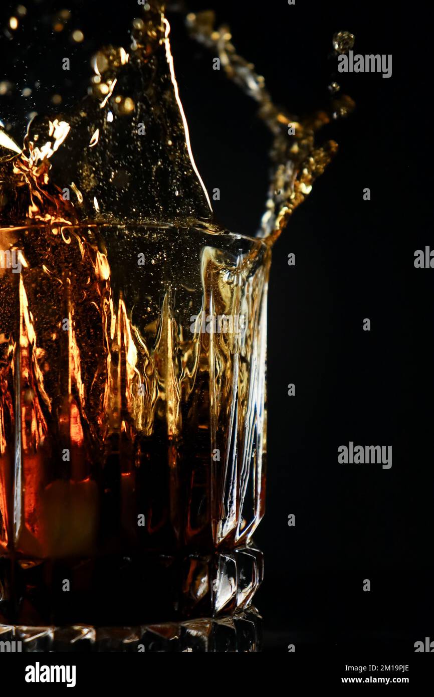 Drink Splashing in glass cup Stock Photo - Alamy