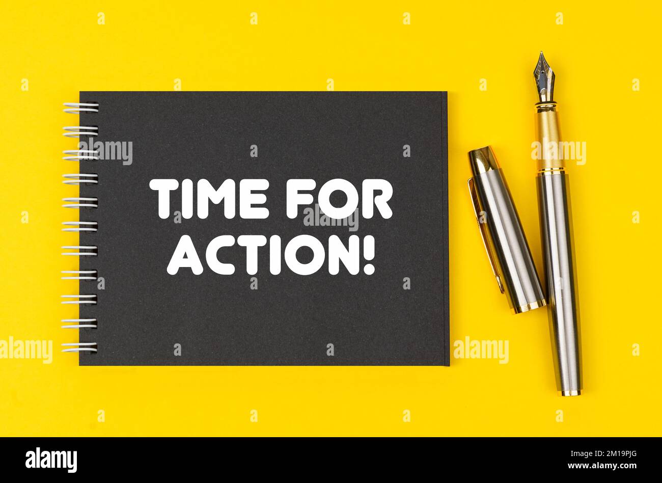 Business and finance concept. On a yellow background lies a pen and a ...
