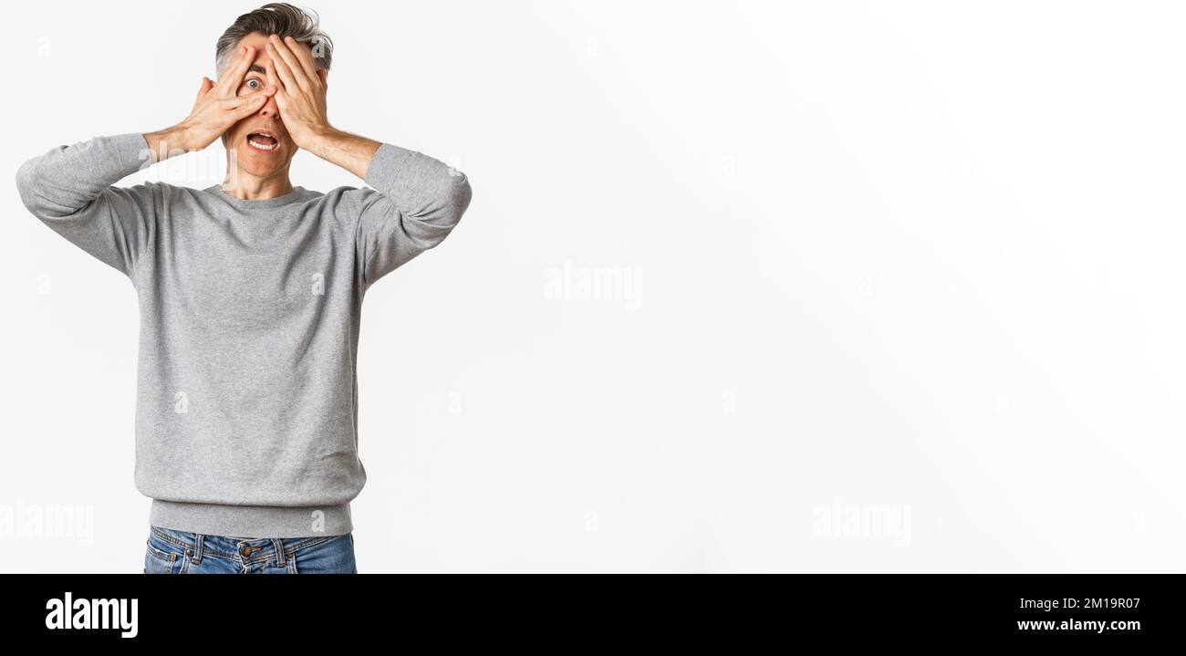 Image of embarrassed of scared middle-aged man cover his eyes with ...