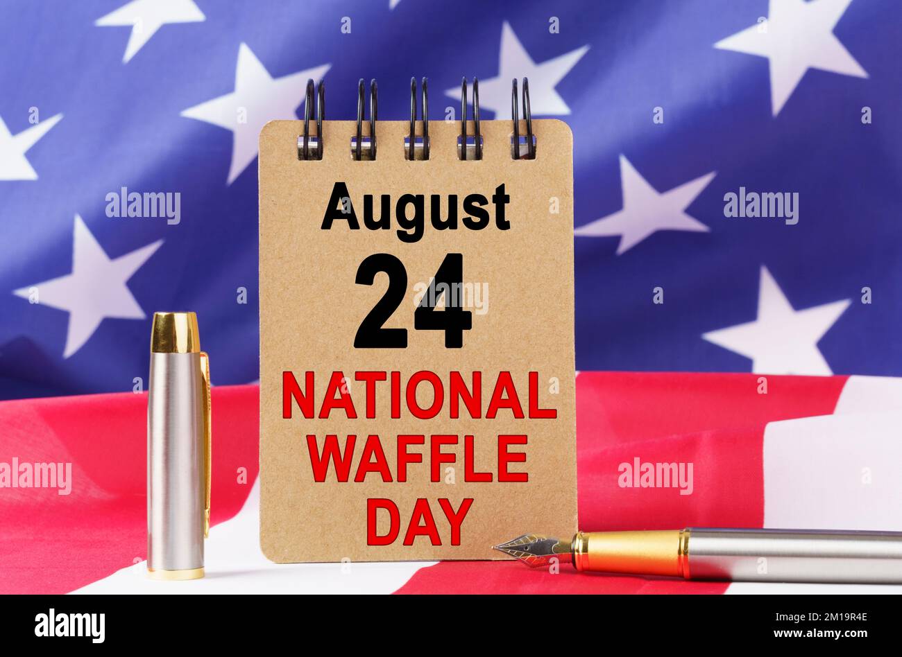 USA Holidays. Against the background of the US flag lies cardboard with ...