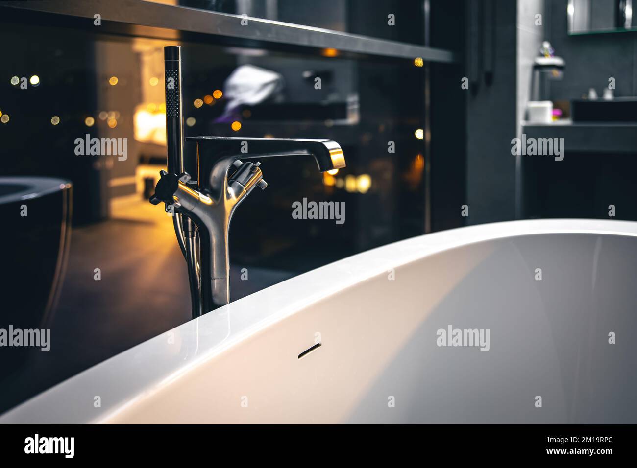 Steel faucet in the interior of a modern bathroom with a window Stock ...