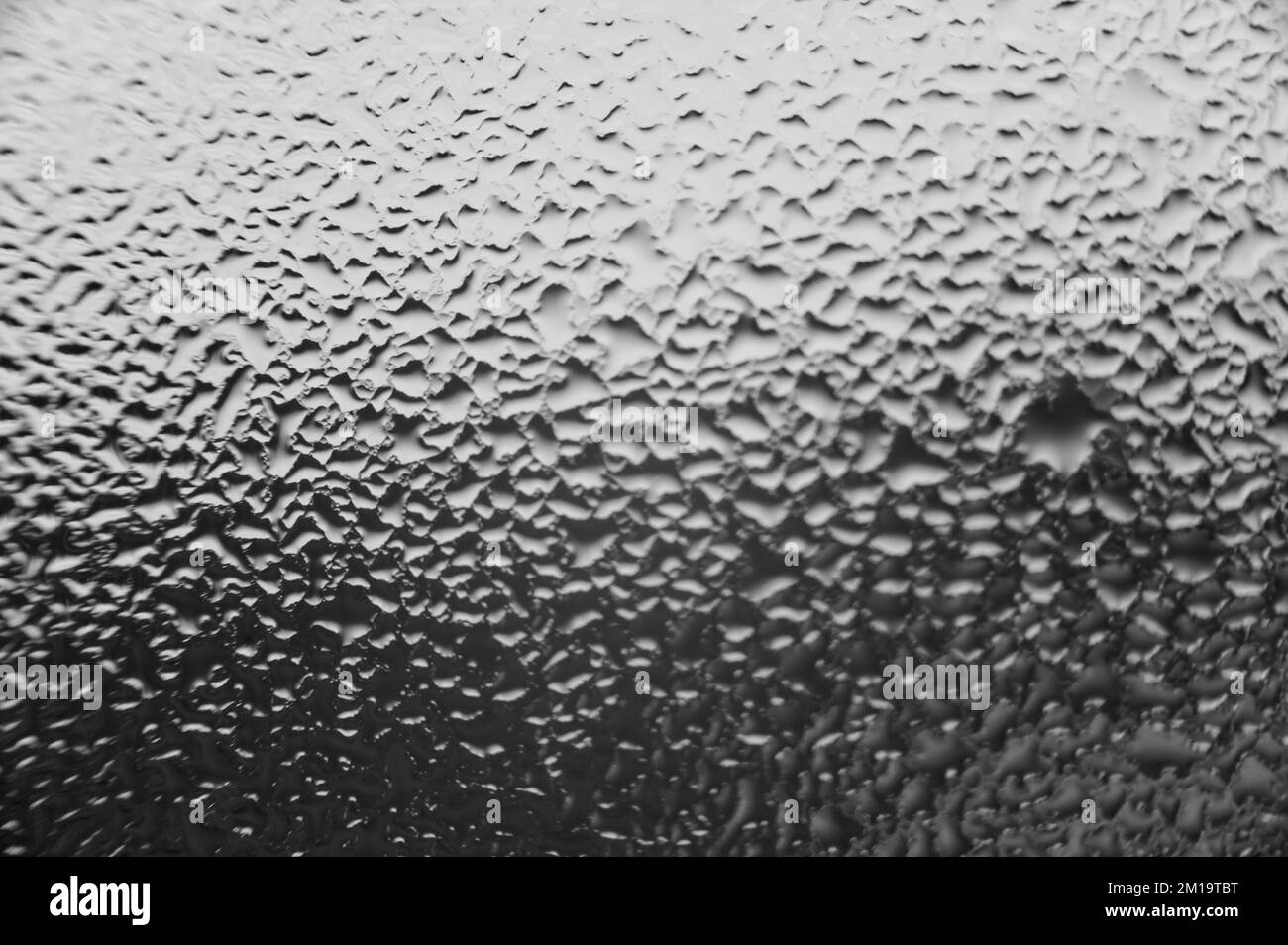 large drops of dew on the window after condensation on the window ...