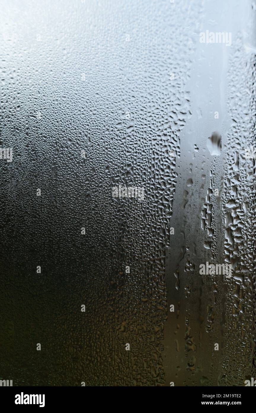 Dew drops and condensation on glass, cold season and high humidity on ...