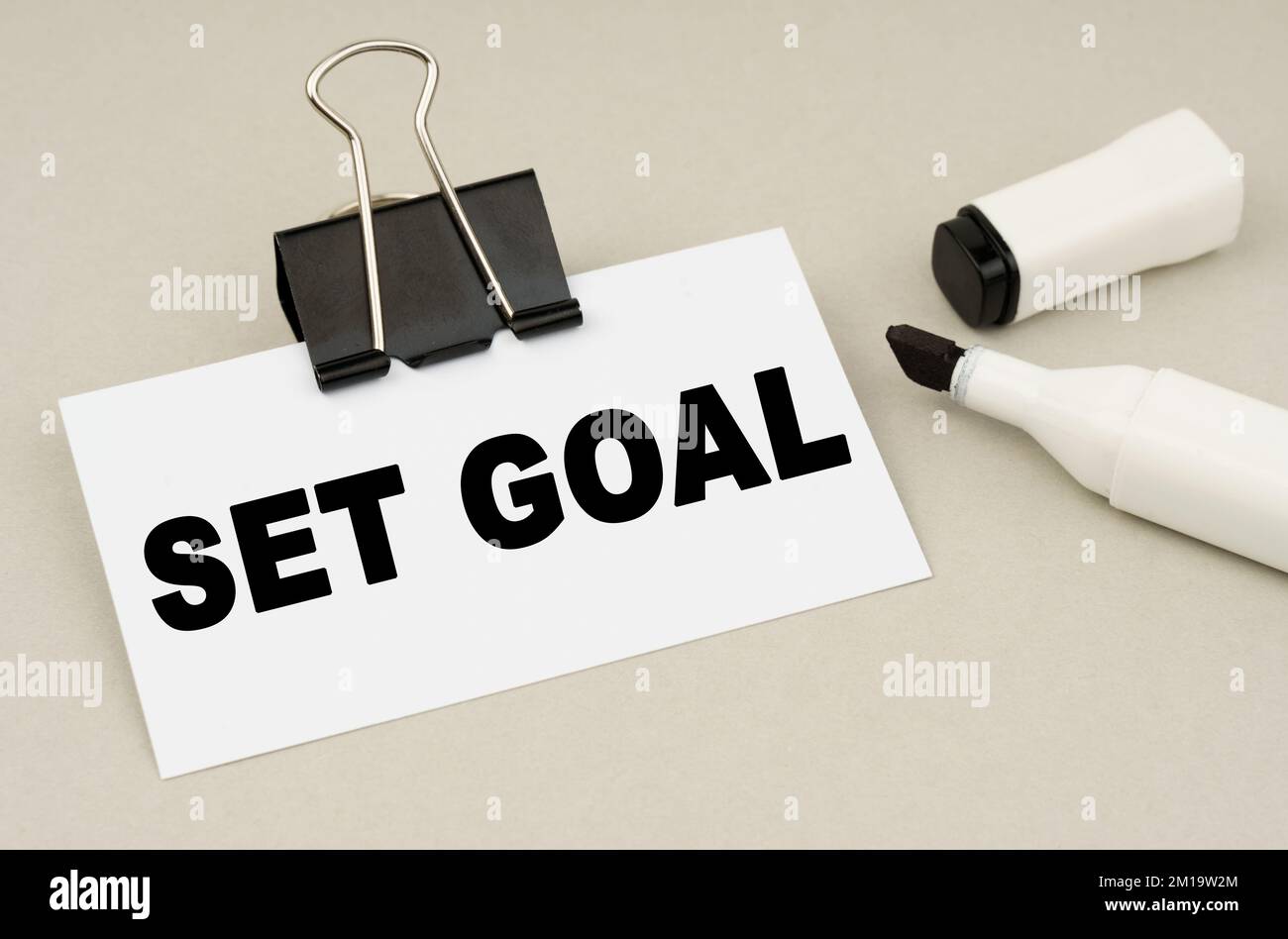 Finance and business concept. On a gray background lies a marker and a ...