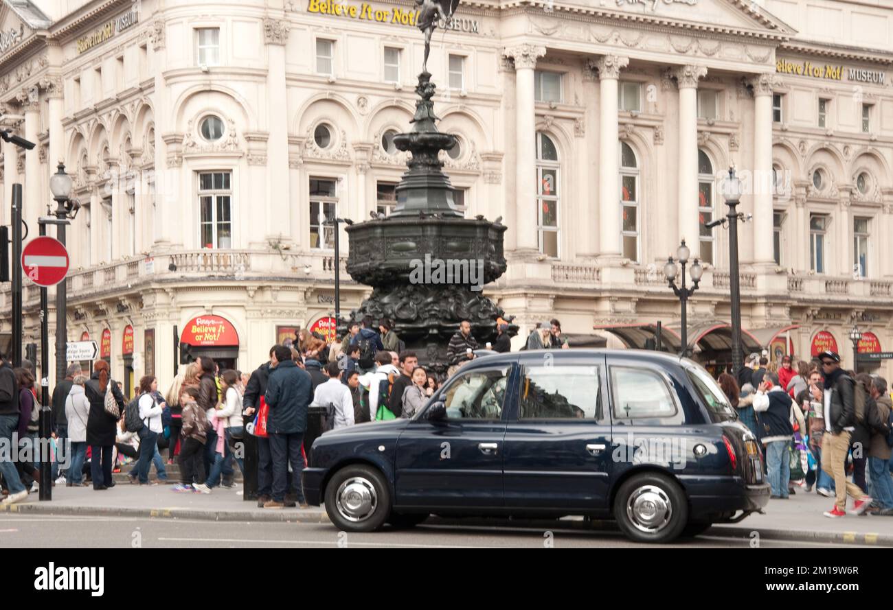 Piccadilly Circus on a busy day, Piccadilly, London, UK; many people ...