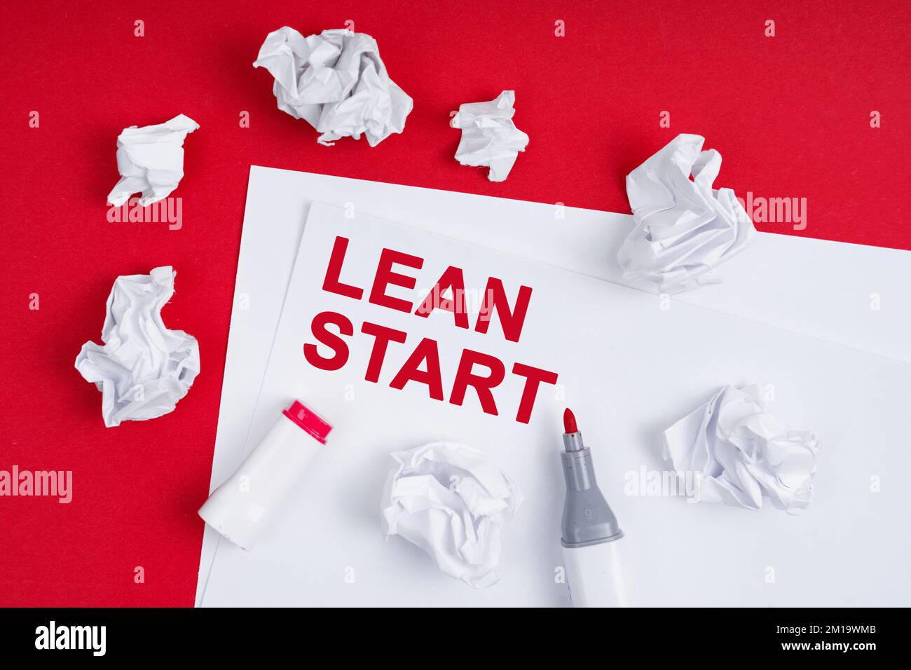Business and finance concept. On a red background lies crumpled paper ...