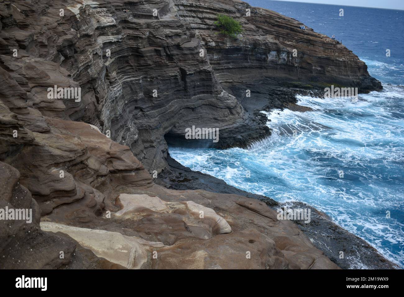 Famous and dangerous cliff jumping spot on Oahu, Spitting Caves Stock ...
