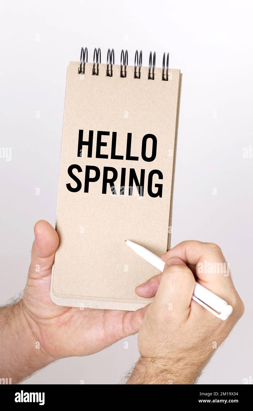 People and holidays concept. A man holds in his hands a pen and a ...