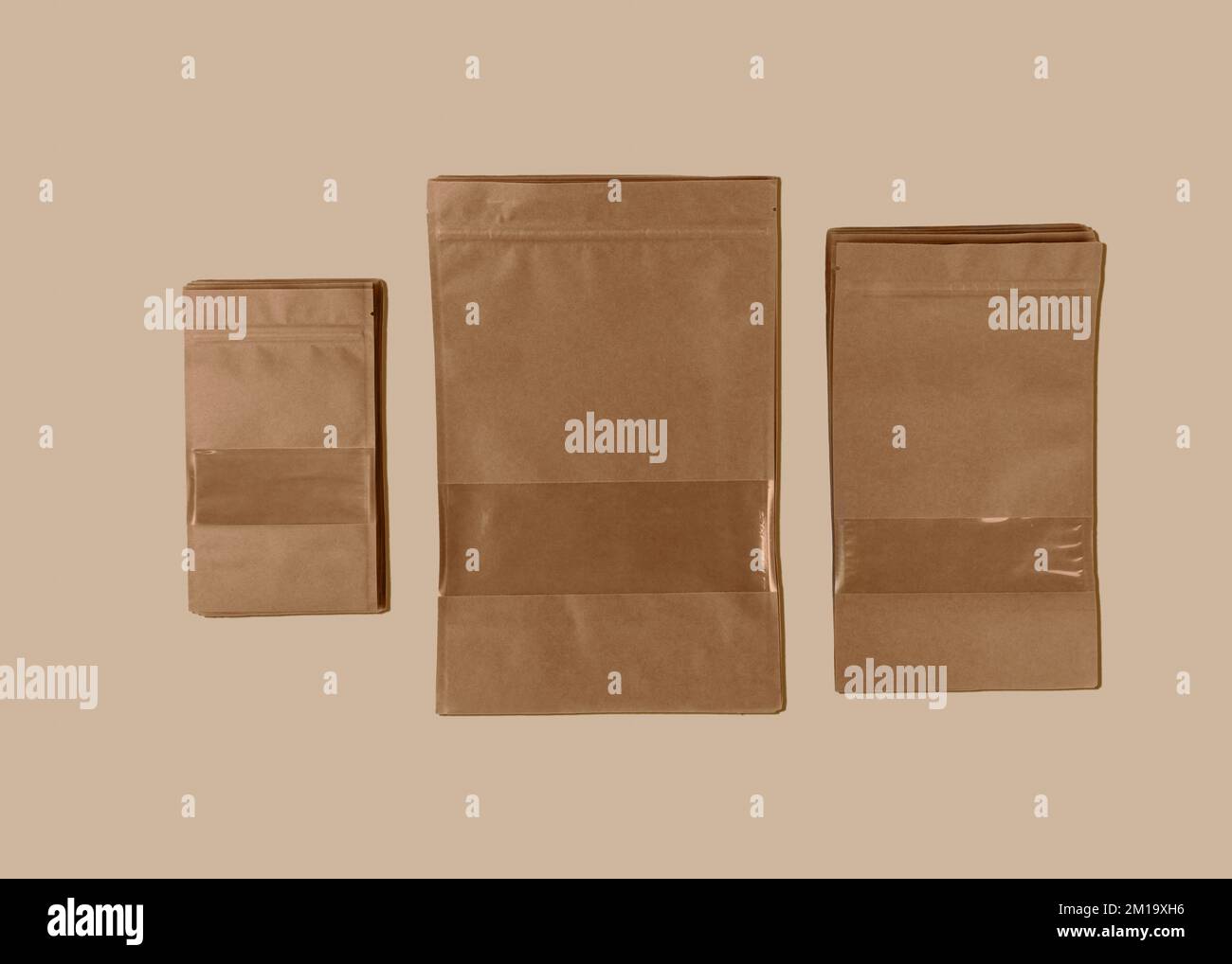 Brown kraft paper doypack bags with groceries front view on a yellow ...