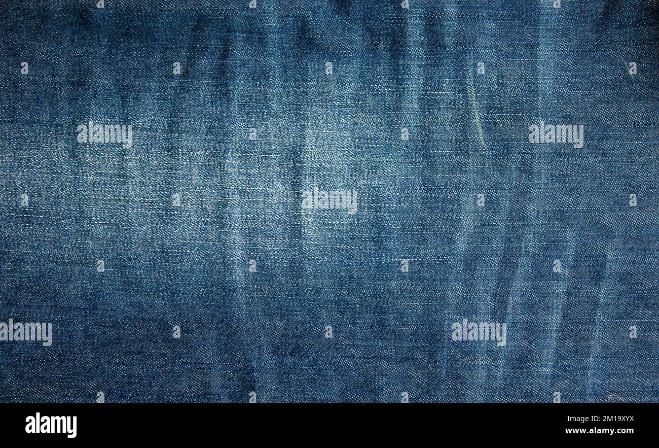 Blue denim background. Texture of classic frayed jeans Stock Photo - Alamy