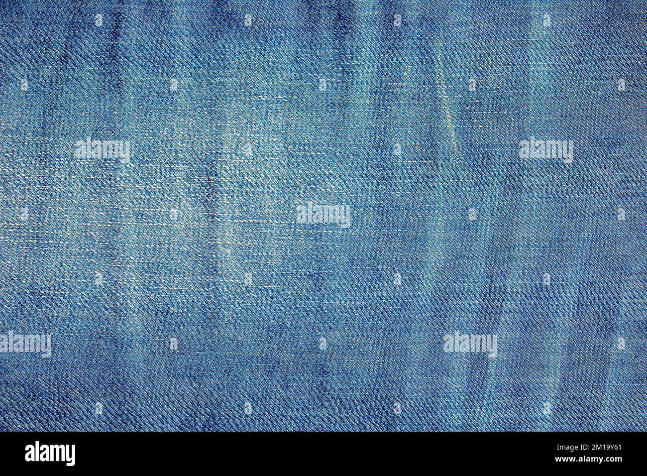 Blue denim background. Texture of classic frayed jeans Stock Photo - Alamy