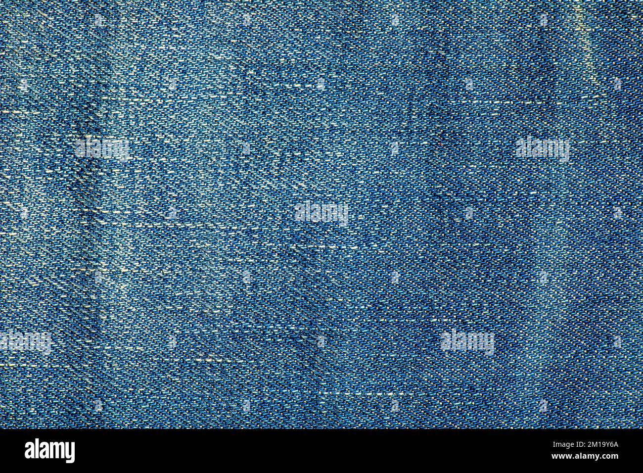 Blue denim background. Texture of classic frayed jeans Stock Photo - Alamy