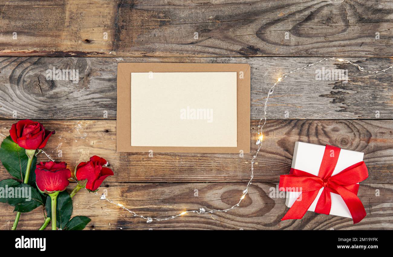 Envelope and blank paper on wooden background, Valentine's day concept ...