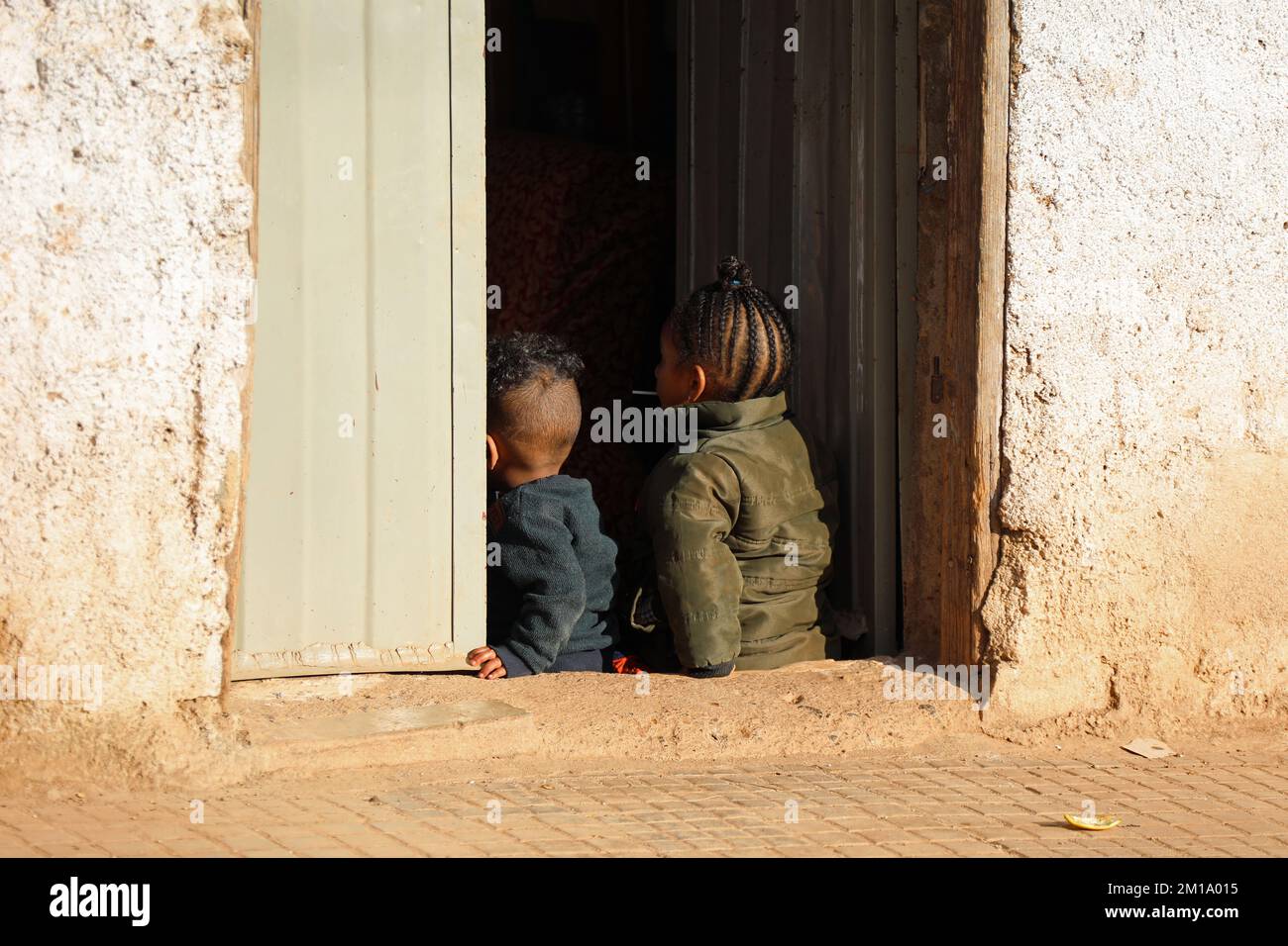 Eritrean children sitting in a doorway Stock Photo - Alamy