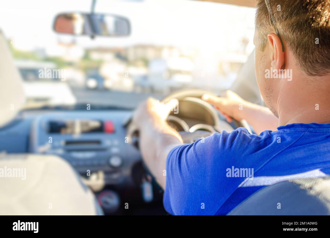 The driver keeps hands on the steering wheel of the car Stock Photo - Alamy