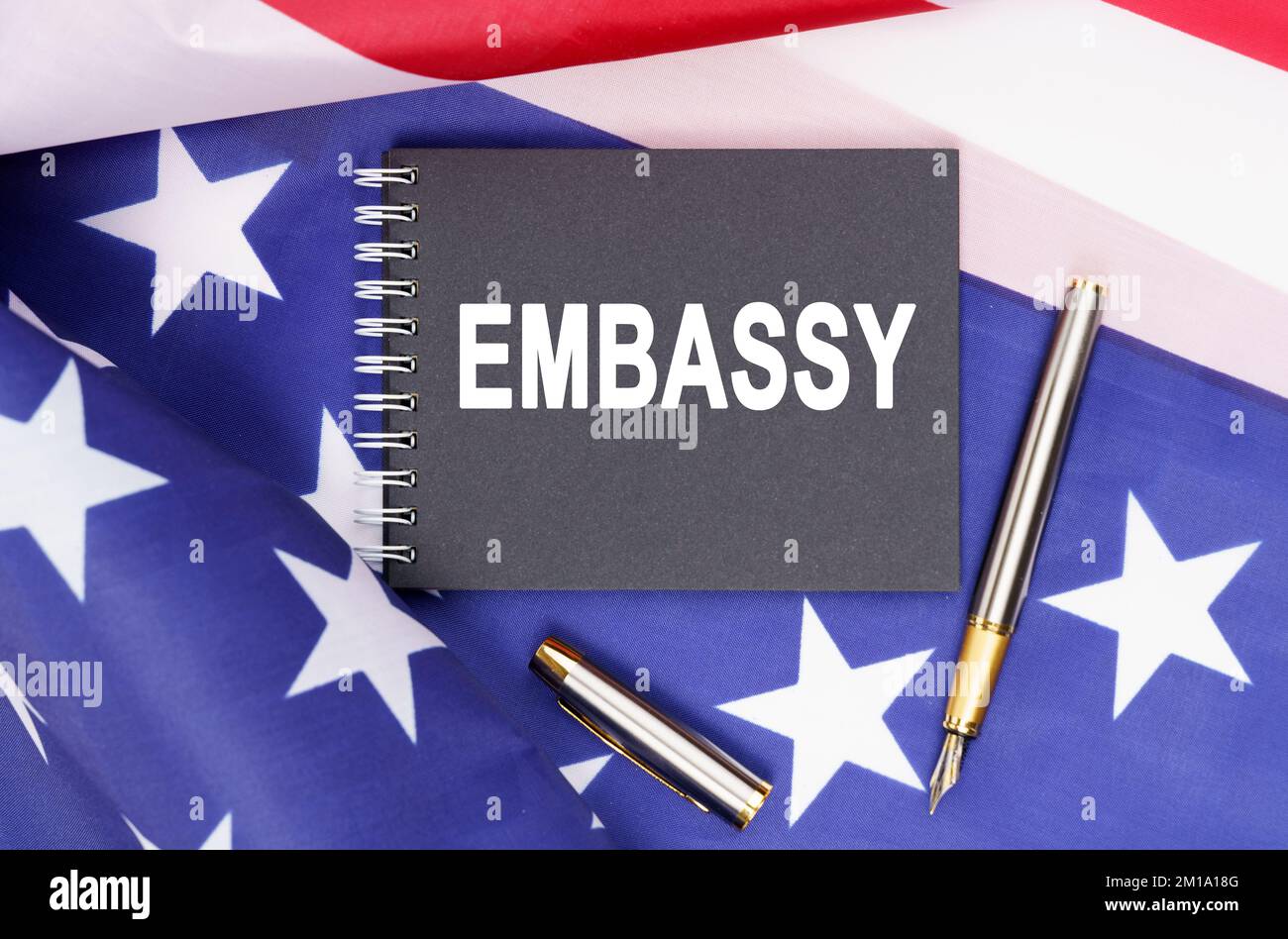American concept. The US flag has a pen and a notebook with the ...
