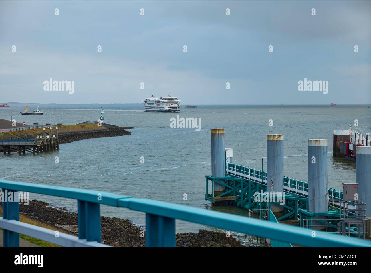 ferry arrives at the jetty for a crossing over the water Stock Photo ...