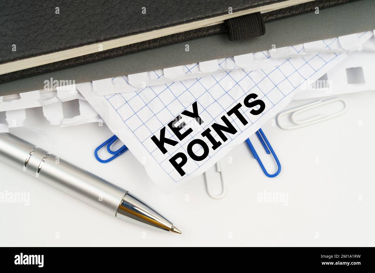 Business concept. On the table is a pen, notebooks and a crumpled sheet ...