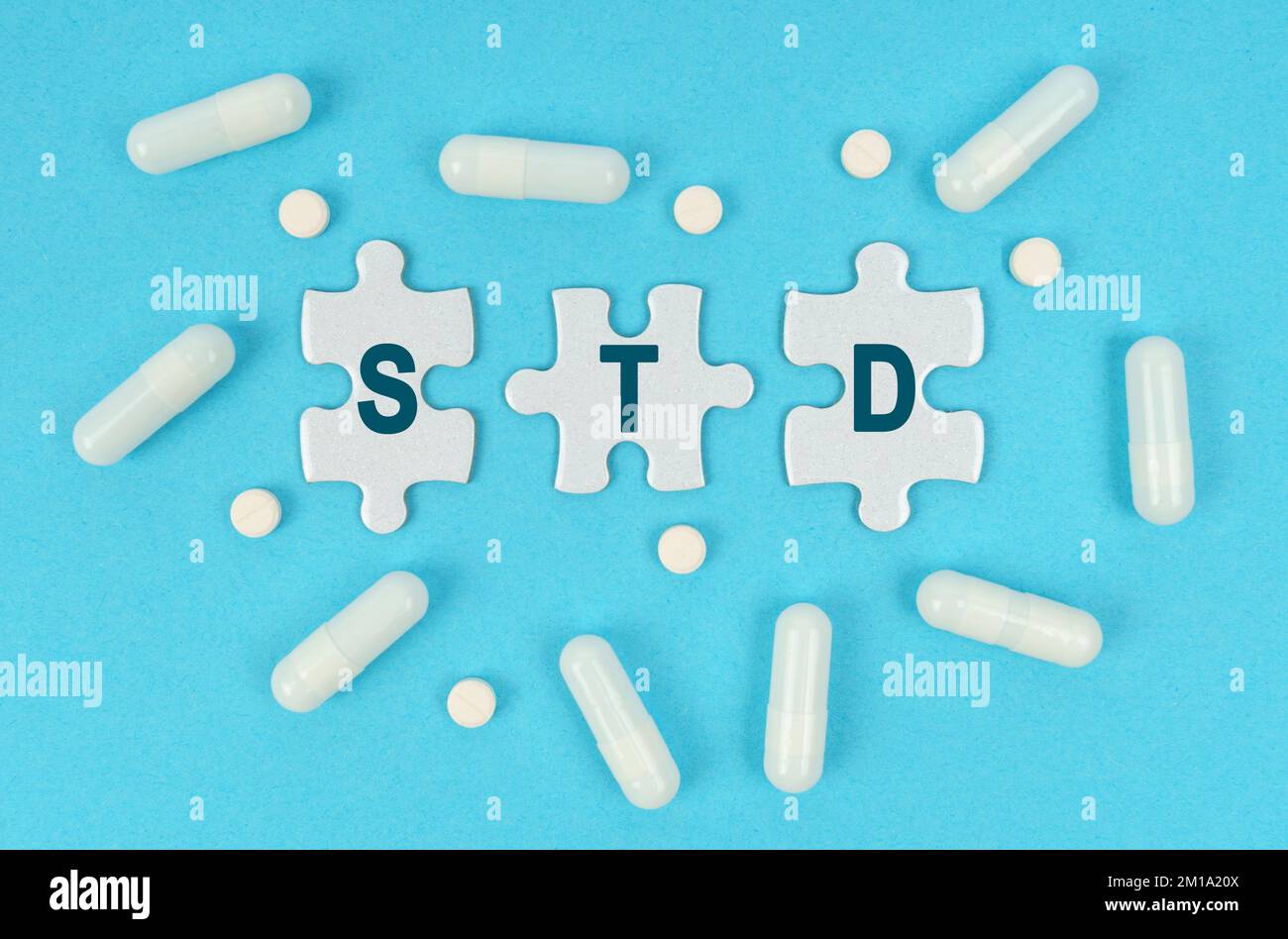 Medicine and health. On a blue background, there are pills and puzzles ...