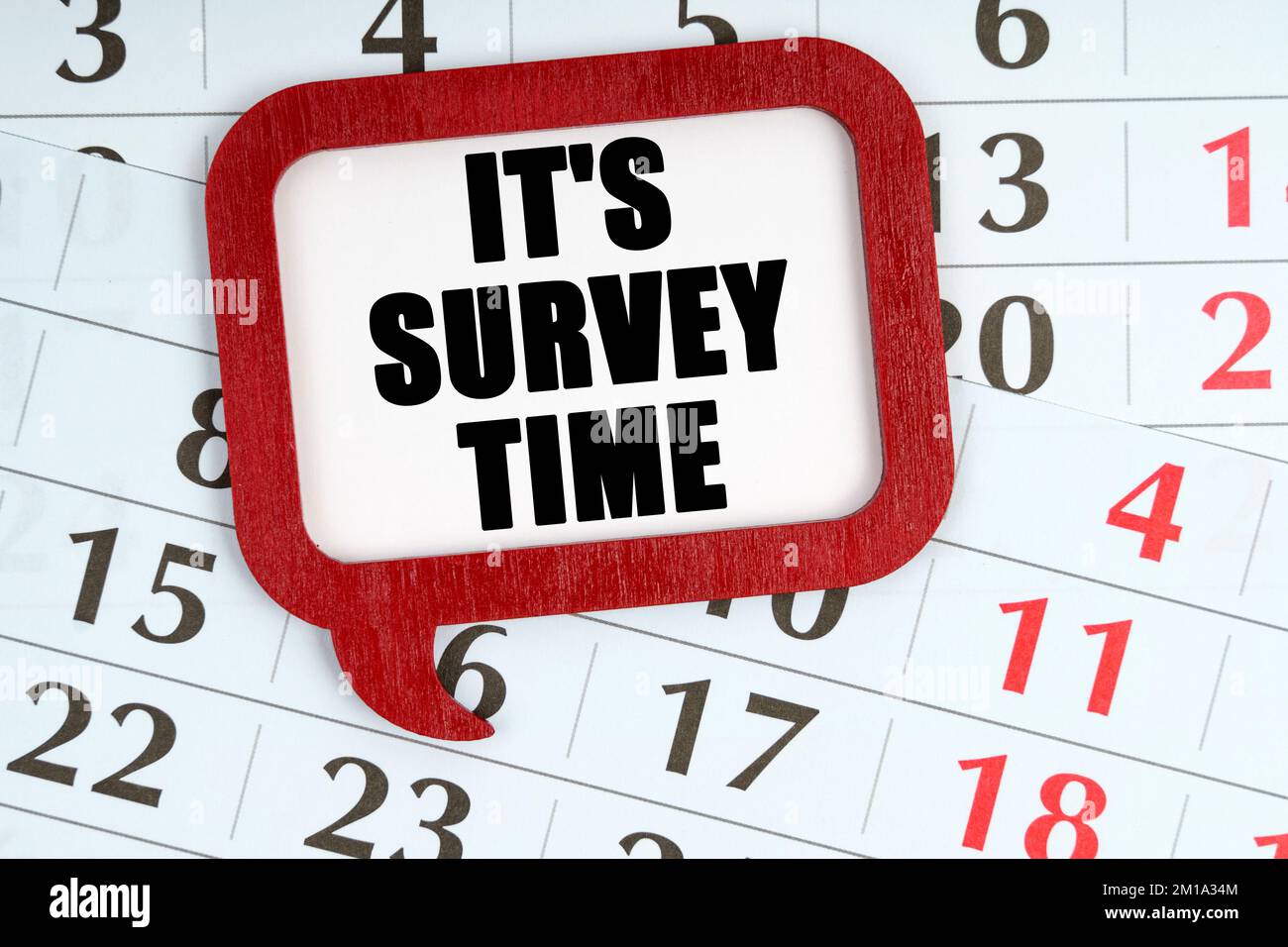 Business concept. On the calendar, a red plaque with the words inside ...