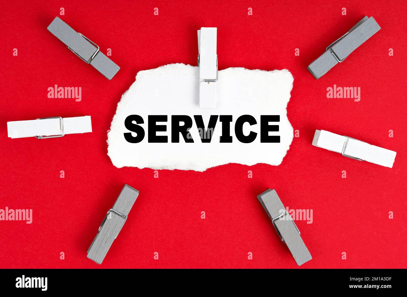 Business and Economics. On a red background, there are clothespins and ...