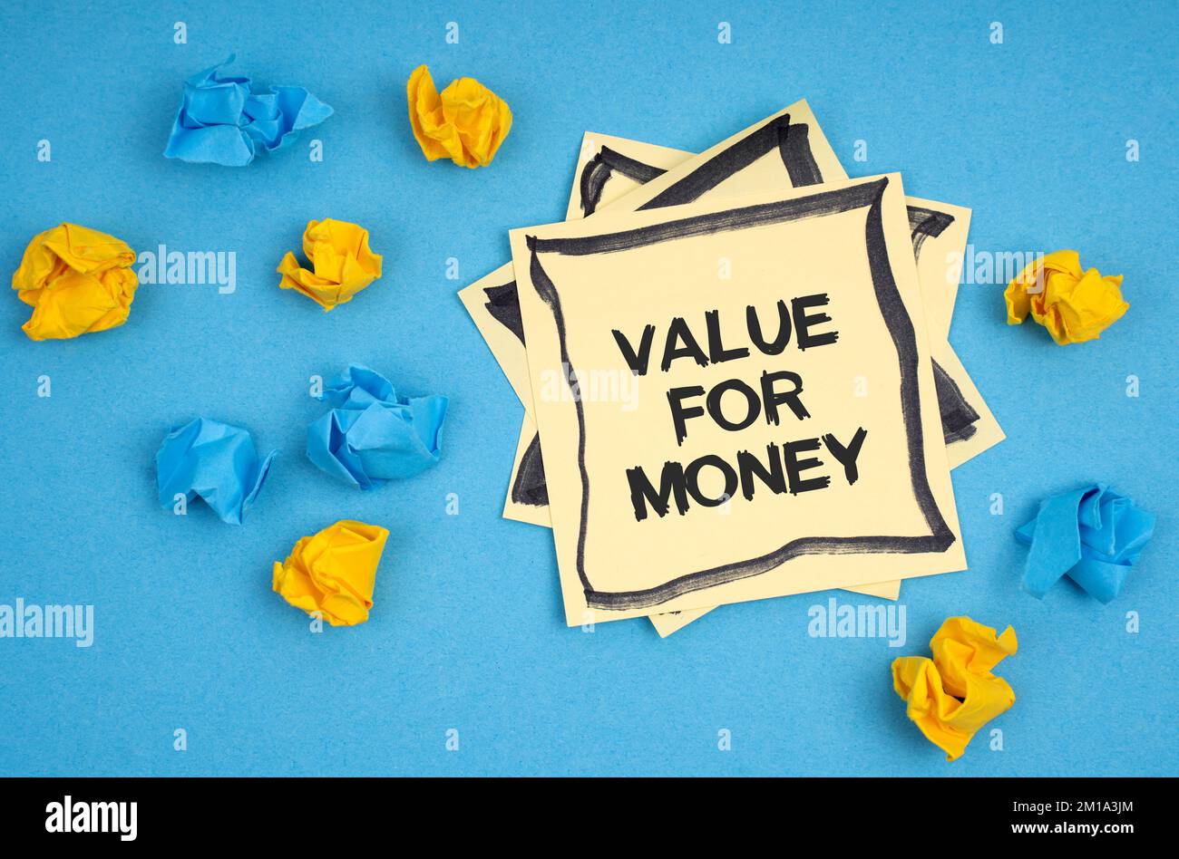 Business concept. On a blue background, there are pieces of paper and a ...