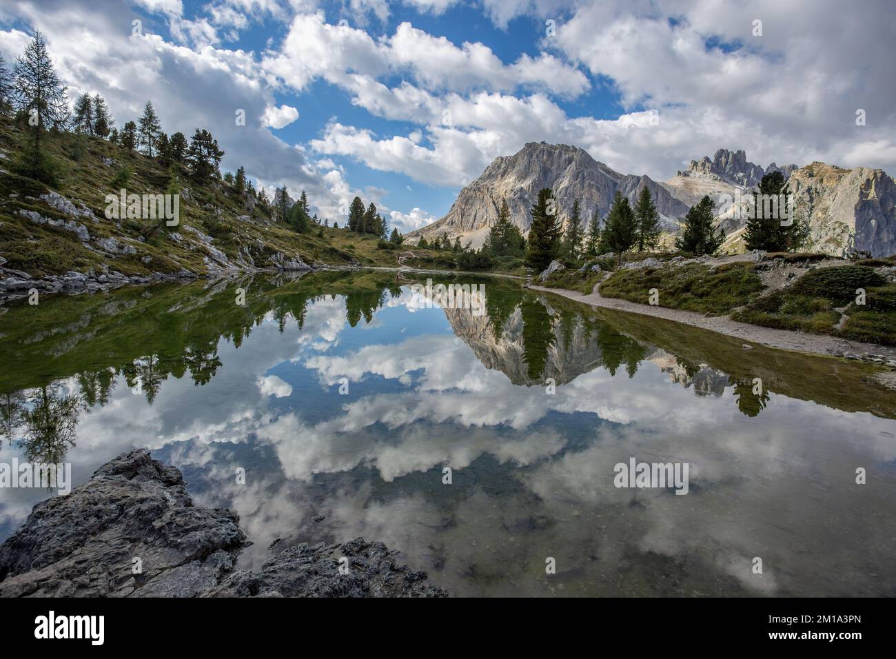 Reflections on Lake Limedes in the Dolomites near Falzarego pass, Italy ...