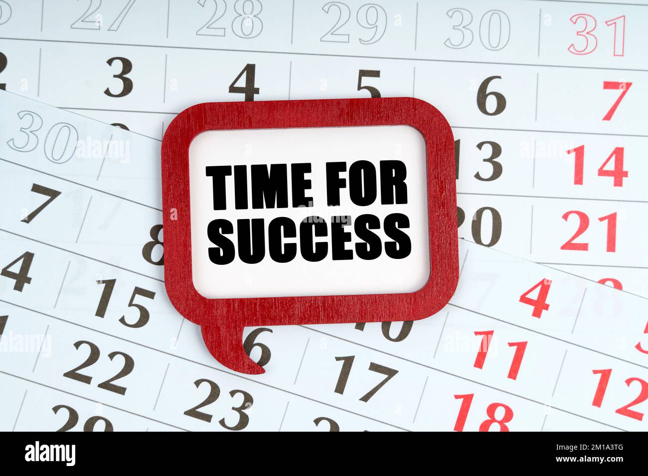 Business concept. On the calendar, a red plaque with the words inside ...