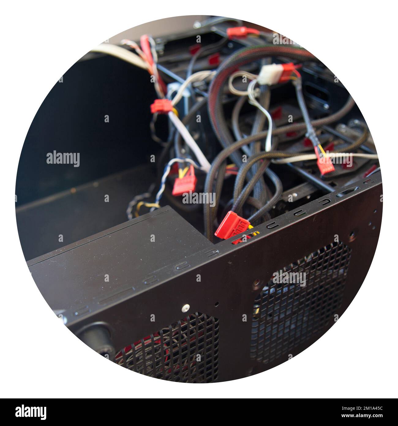 Desktop computer, black empty case and various cables, which are tried ...