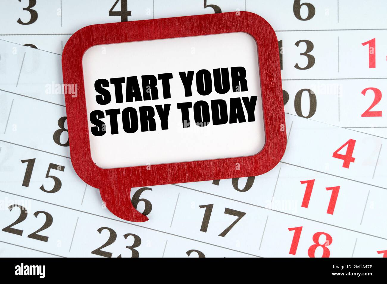 Business concept. On the calendar, a red plaque with the words inside ...