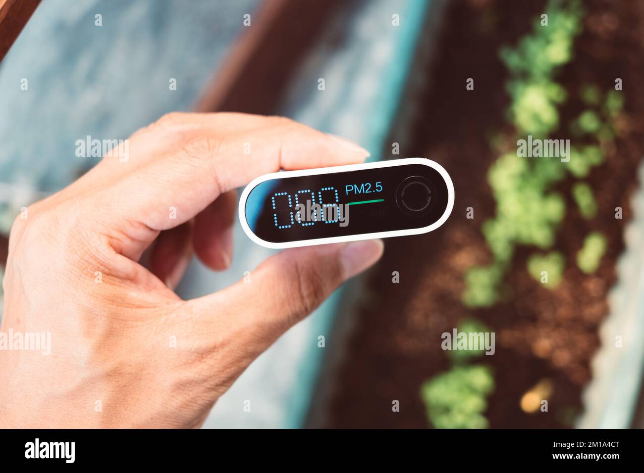 Close up portable air quality monitor detect PM 2.5, the low level is ...