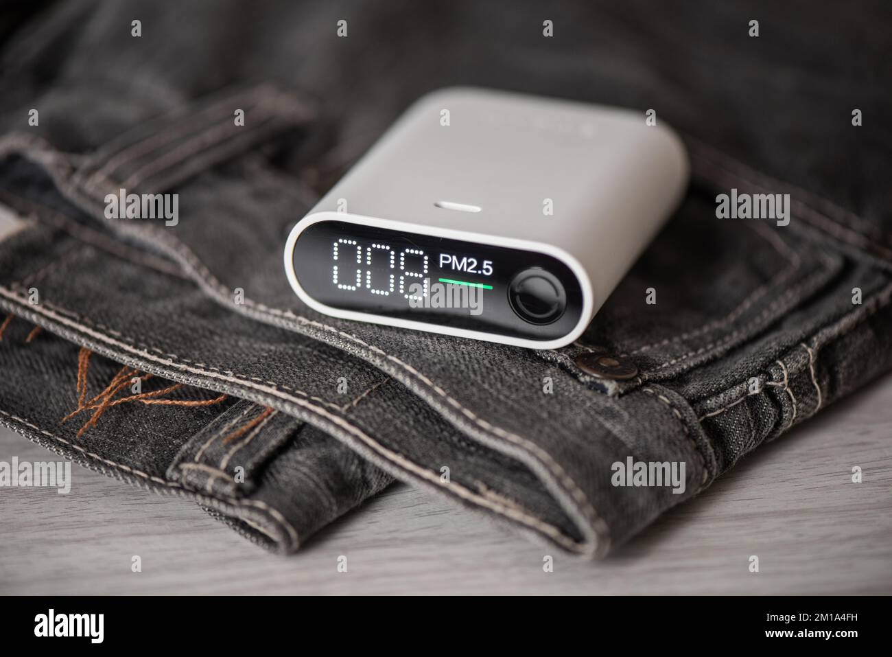 Close up portable air quality monitor detect PM 2.5, the low level is ...