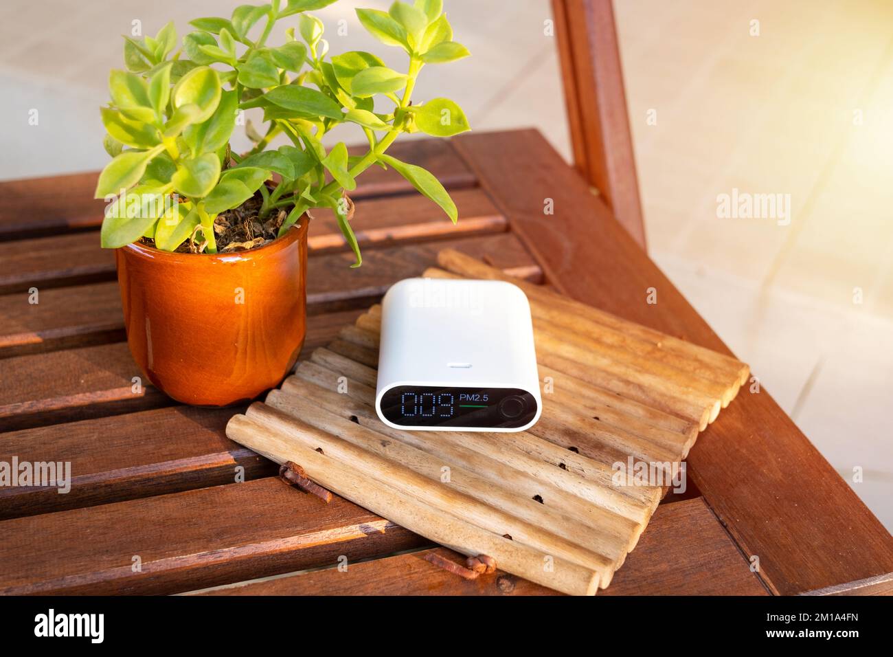 Close up portable air quality monitor detect PM 2.5, the low level is ...