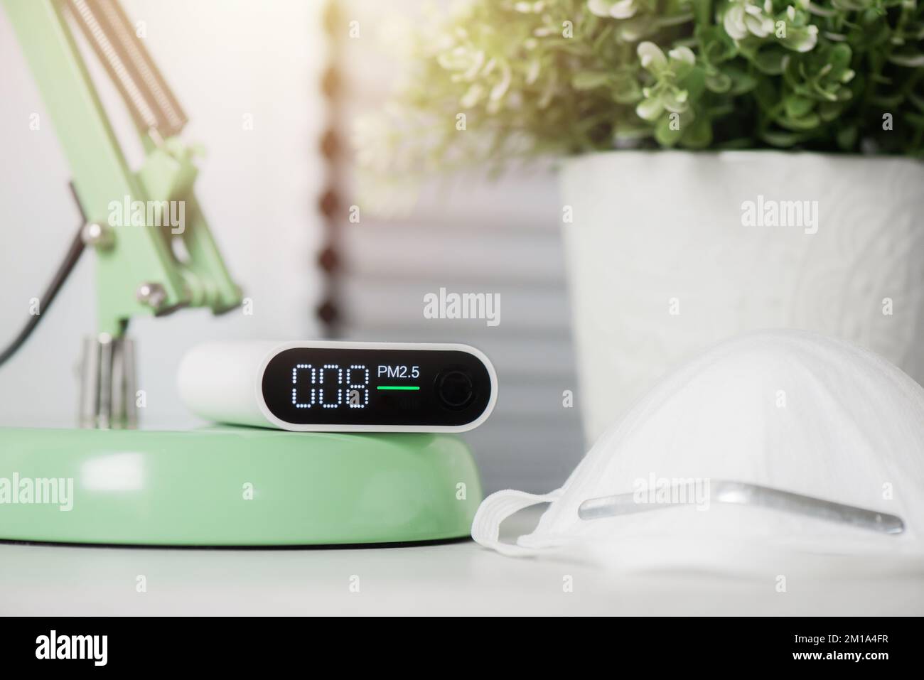 Close up portable air quality monitor detect PM 2.5, the low level is ...