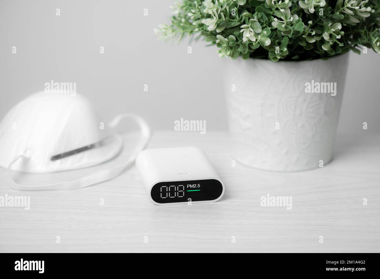 Close up portable air quality monitor detect PM 2.5, the low level is ...