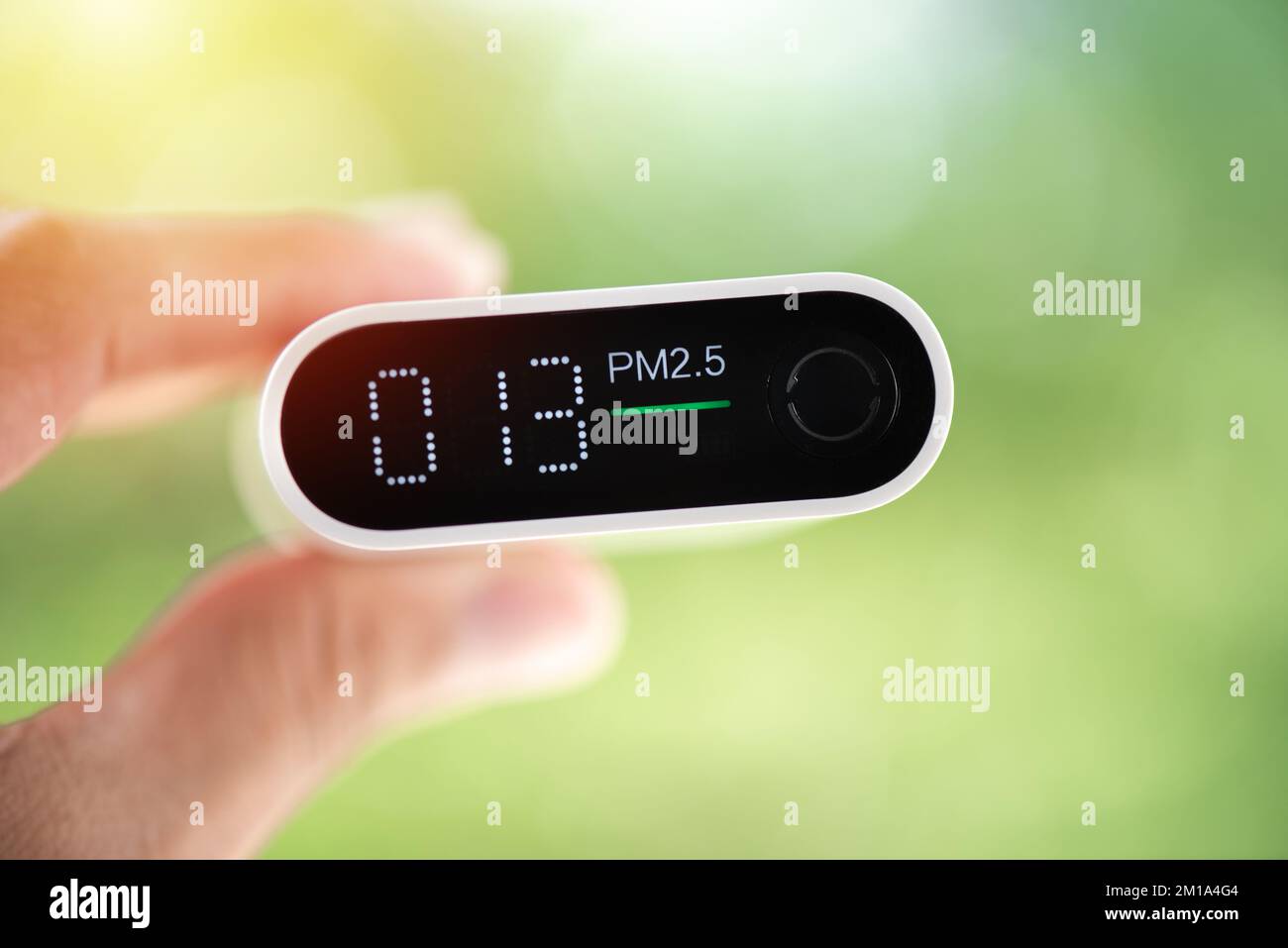 Close up portable air quality monitor detect PM 2.5, the low level is ...
