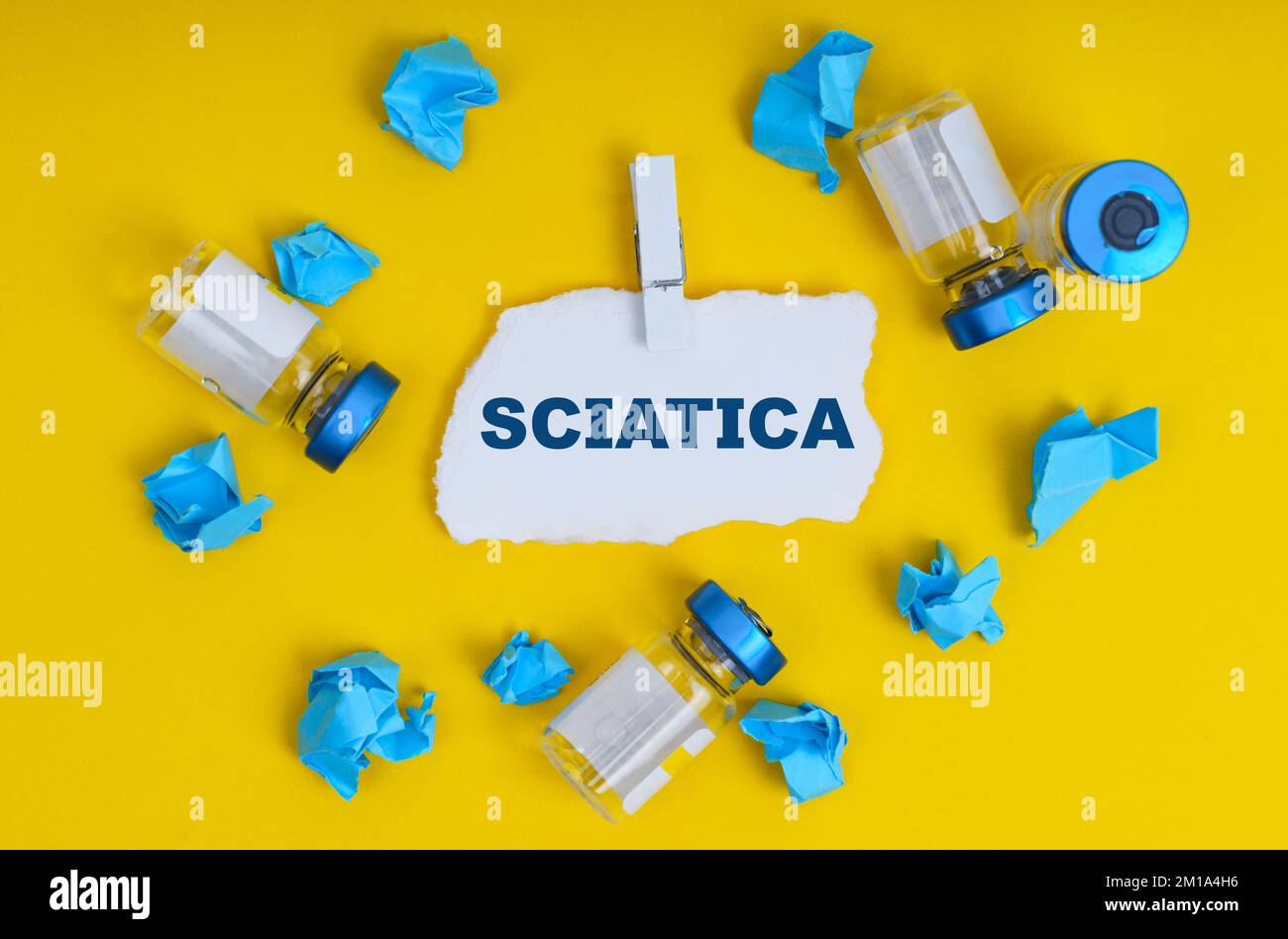Medicine and health concept. On a yellow background are ampoules, blue ...
