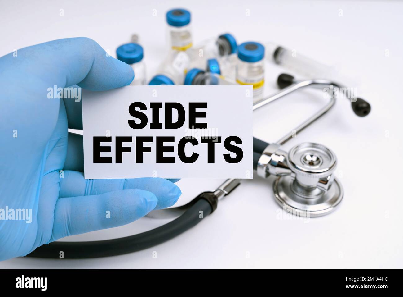 Medicine and health concept. A stethoscope and ampoules lie on a white ...