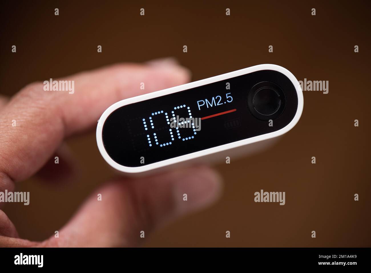 Close up portable air quality monitor detect PM 2.5, the low level is ...