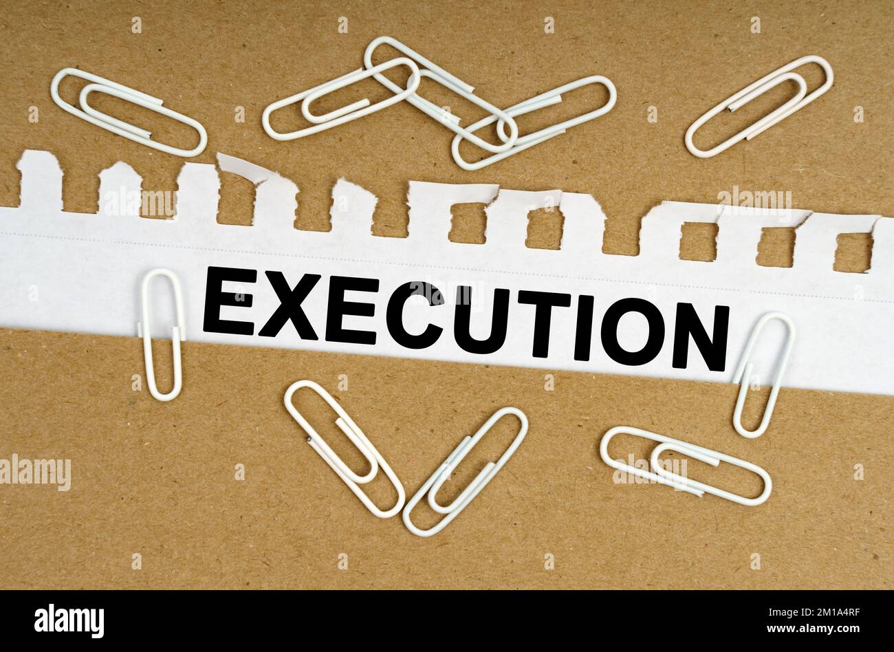 Business concept. On cardboard, white paper clips and a sheet from a ...