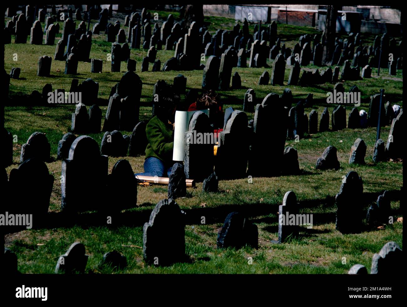 Two people taking gravestone rubbings, Granary Burying Ground, Boston ...
