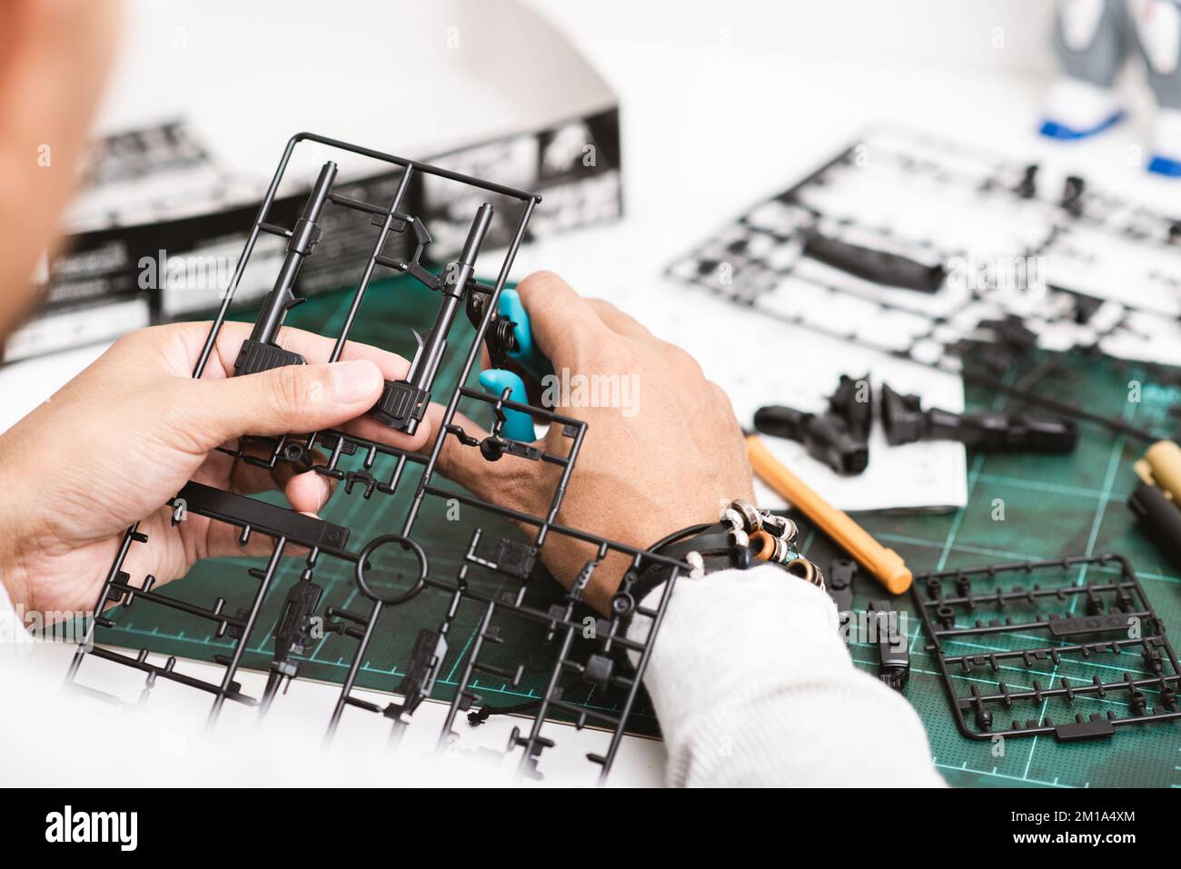 The man assembling robot model kits. Leisure and hobby concept Stock ...