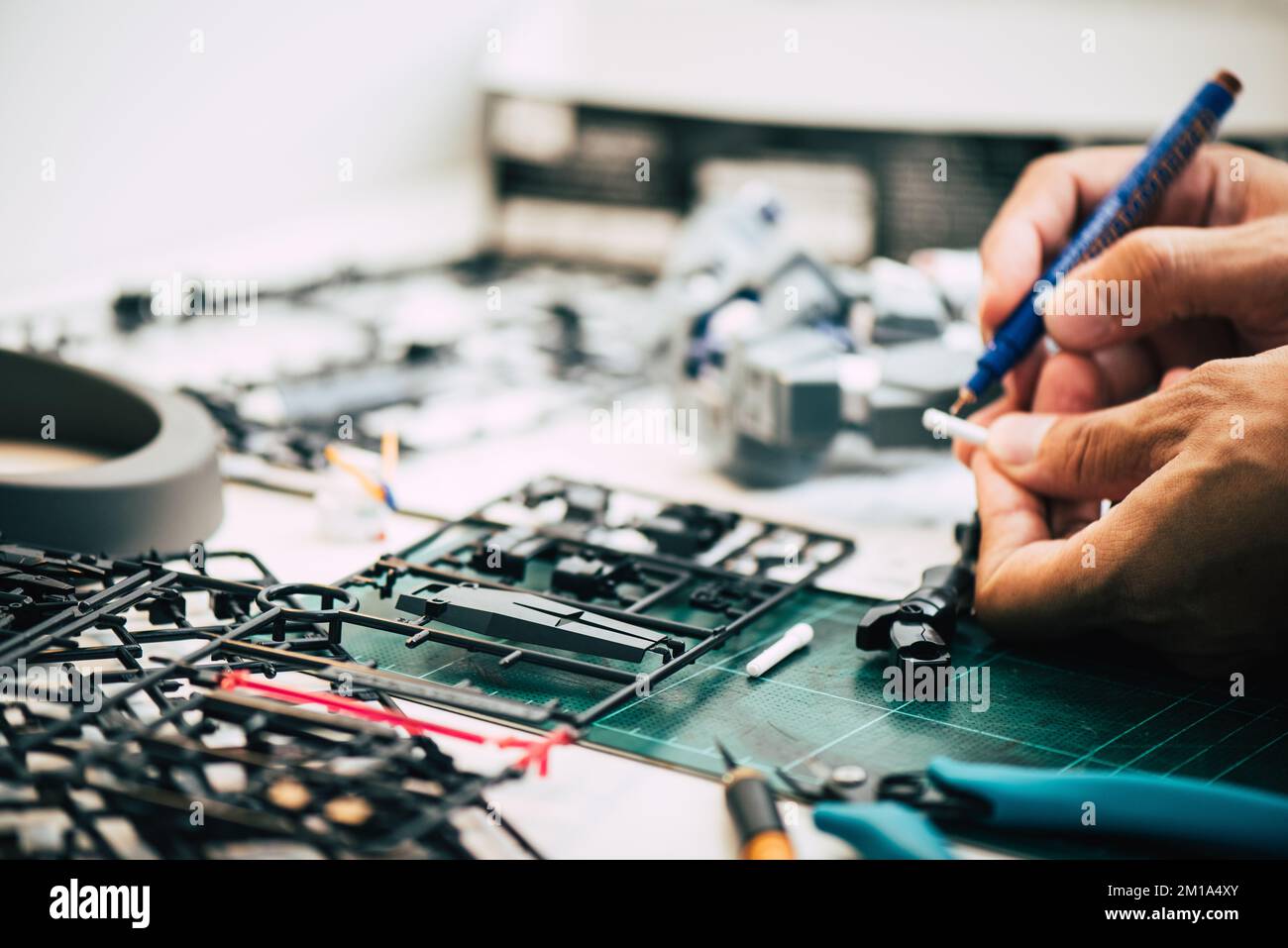 The man assembling robot model kits. Leisure and hobby concept Stock ...