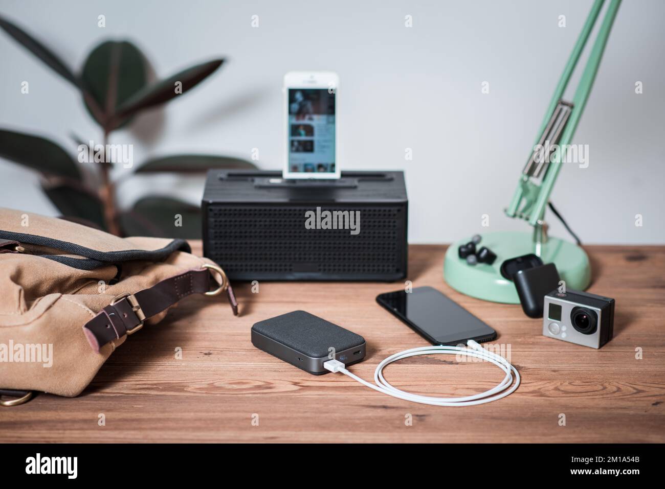 Smartphone battery charging with power bank. close-up at the grey power ...
